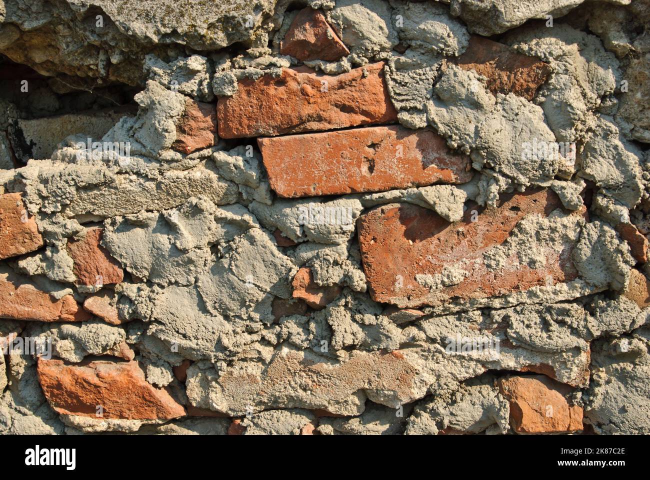 Cracked wall with metal inserts Stock Photo - Alamy