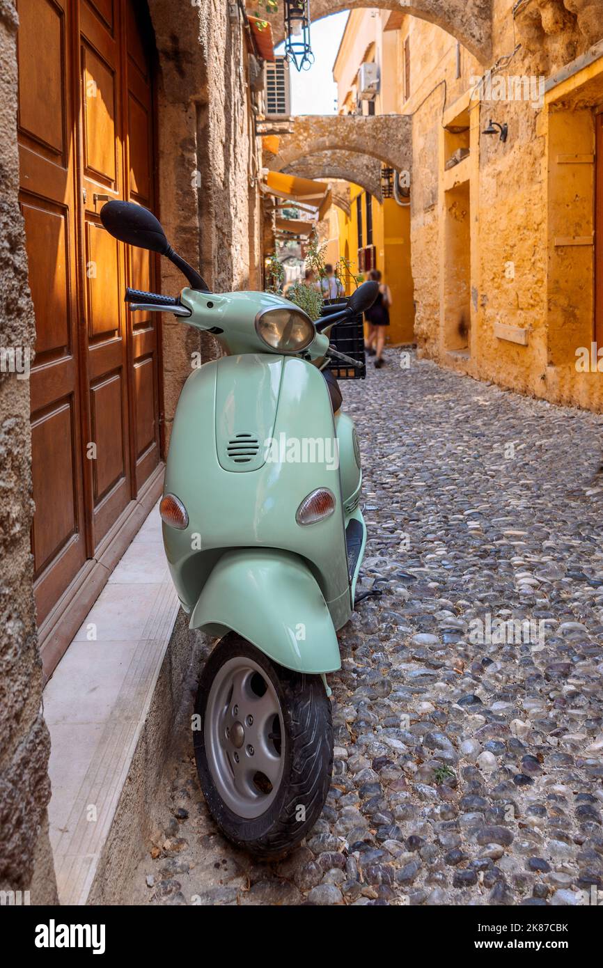 Narrow cobbled historical streets of Rhodes. Tourists walk on Old Town ...