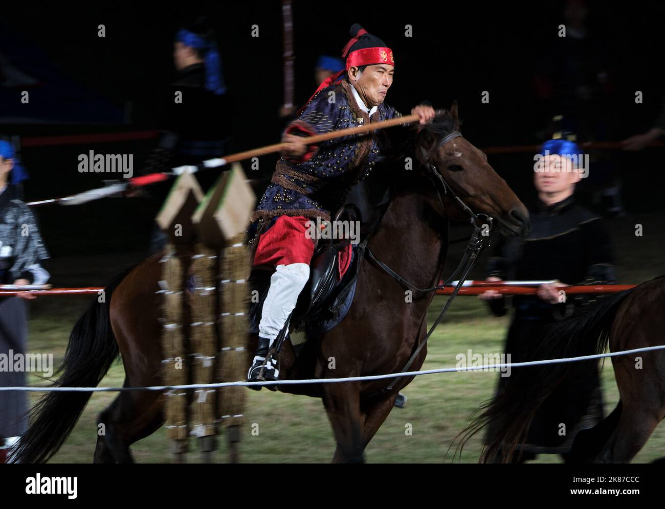 Suwon, Gyeonggi-do - 10 07 2022: A man is riding a horse and hitting a ...
