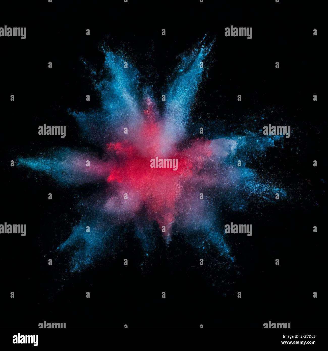 Colorful powder explosion on black Stock Photo - Alamy