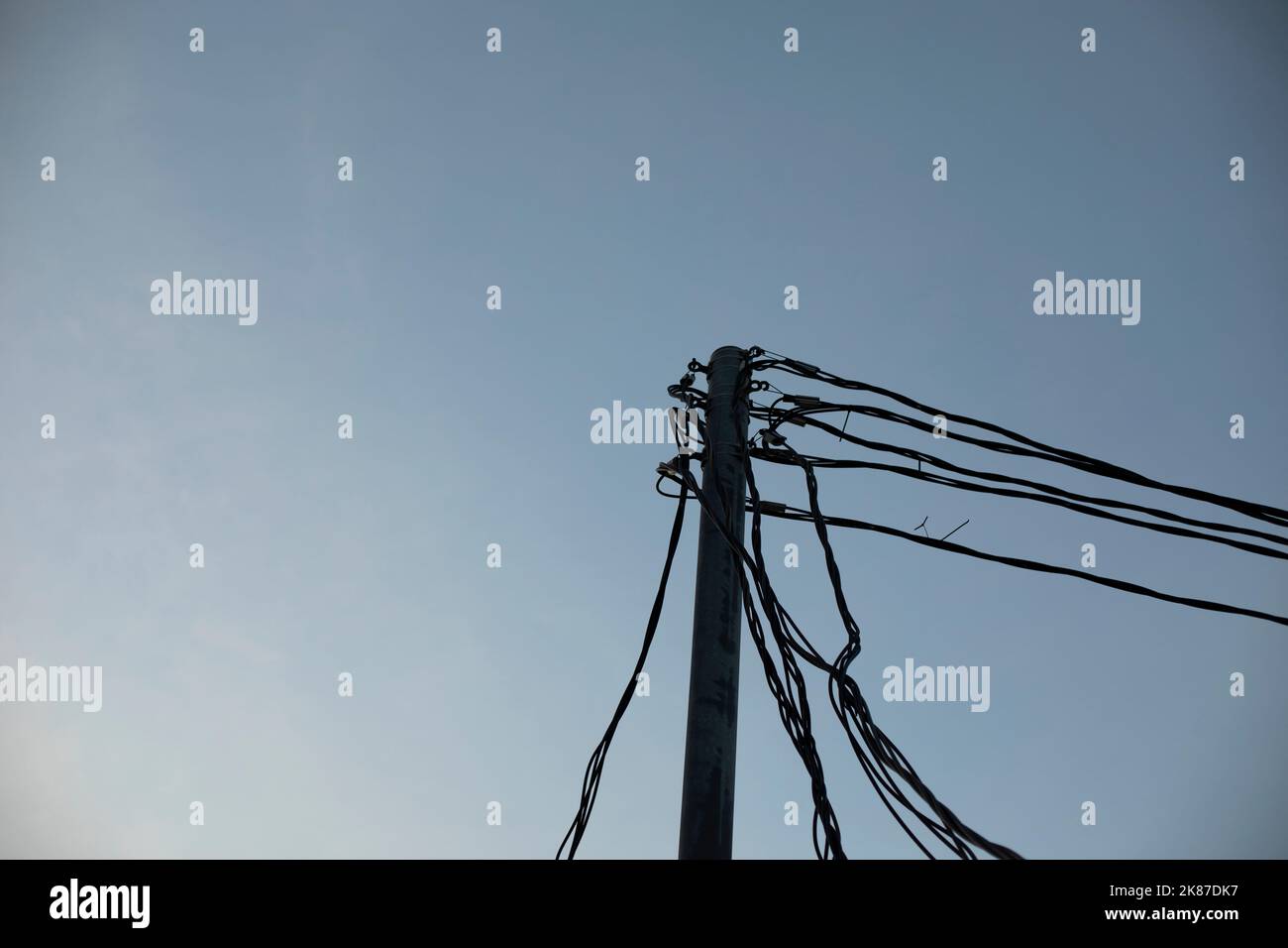 Electrical wires on pole. Many wires against sky. High voltage pole ...