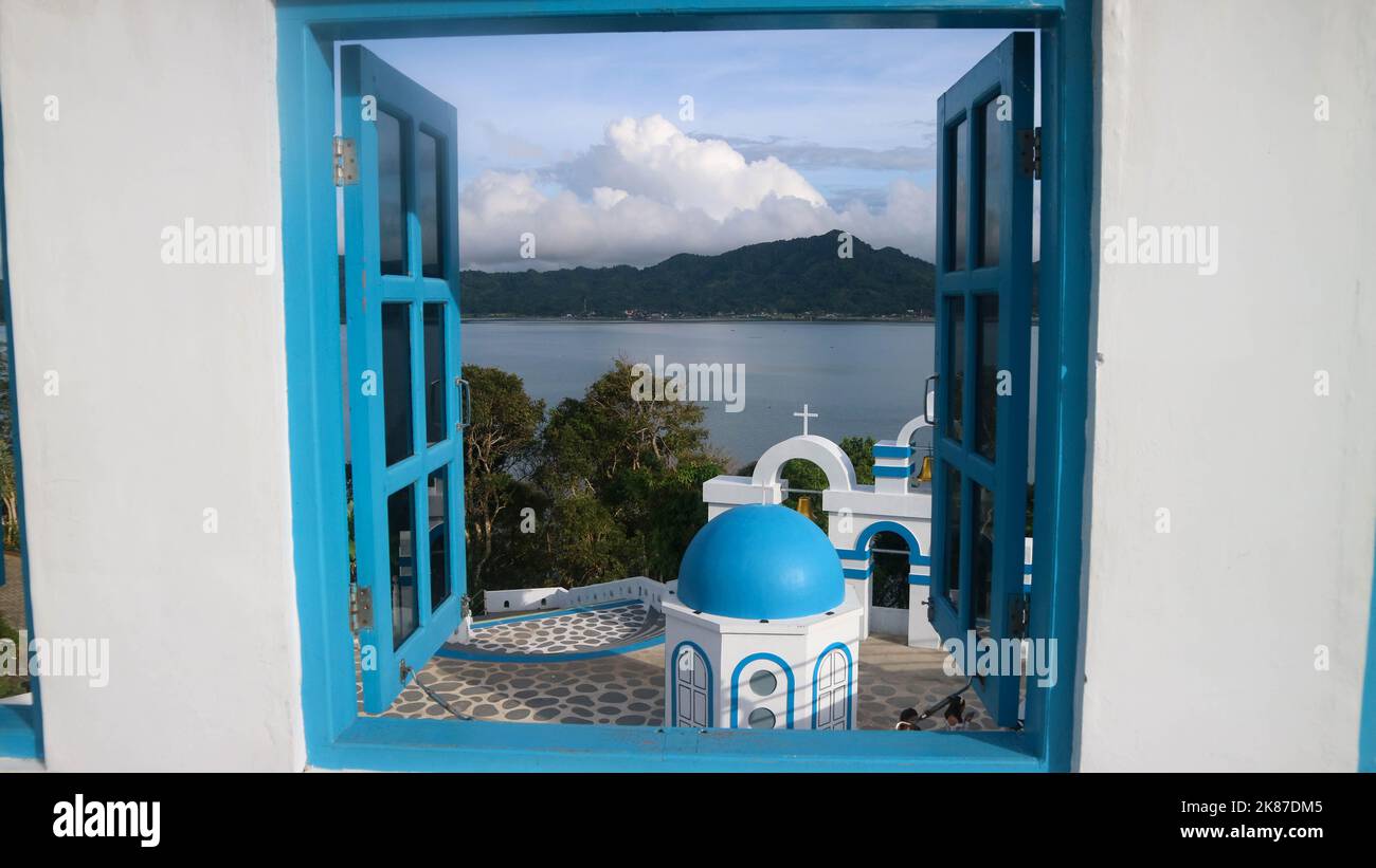 view of lake tondano from a window Stock Photo - Alamy
