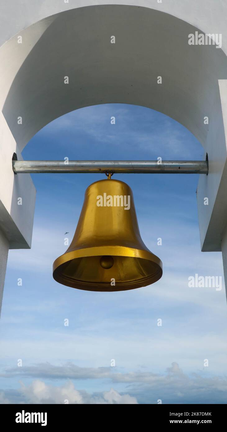 a golden bell and a blue sky Stock Photo - Alamy