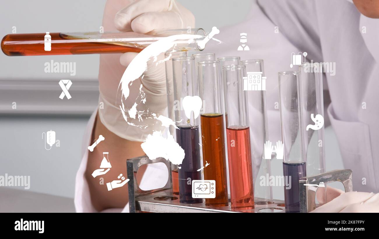 A lab tech mixing liquids Stock Photo - Alamy