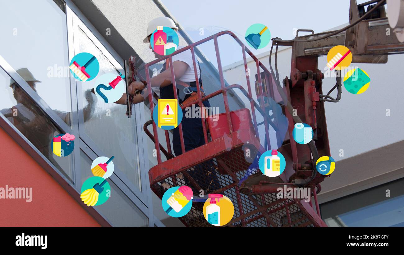Window cleaner cleans window with foam and puller Stock Photo - Alamy