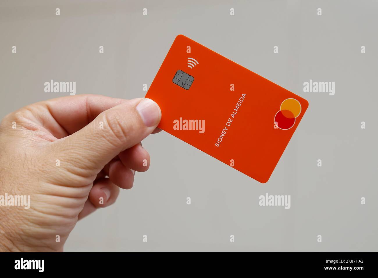 Minas Gerais, Brazil - July 09, 2022: orange credit card with ...