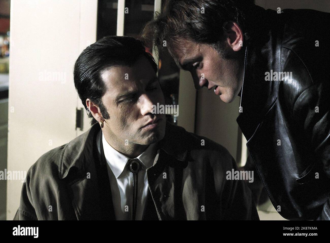 QUENTIN TARANTINO and JOHN TRAVOLTA in PULP FICTION (1994), directed by ...