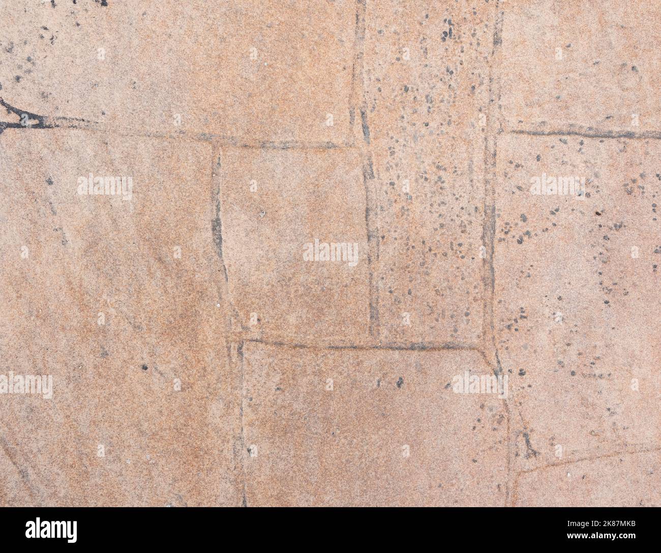 Stamped concrete pavement with irregular pattern background. Front view ...
