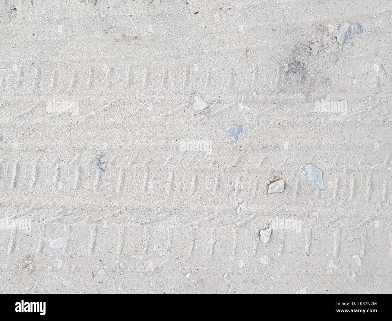 White sand on road with tire tracks Stock Photo - Alamy