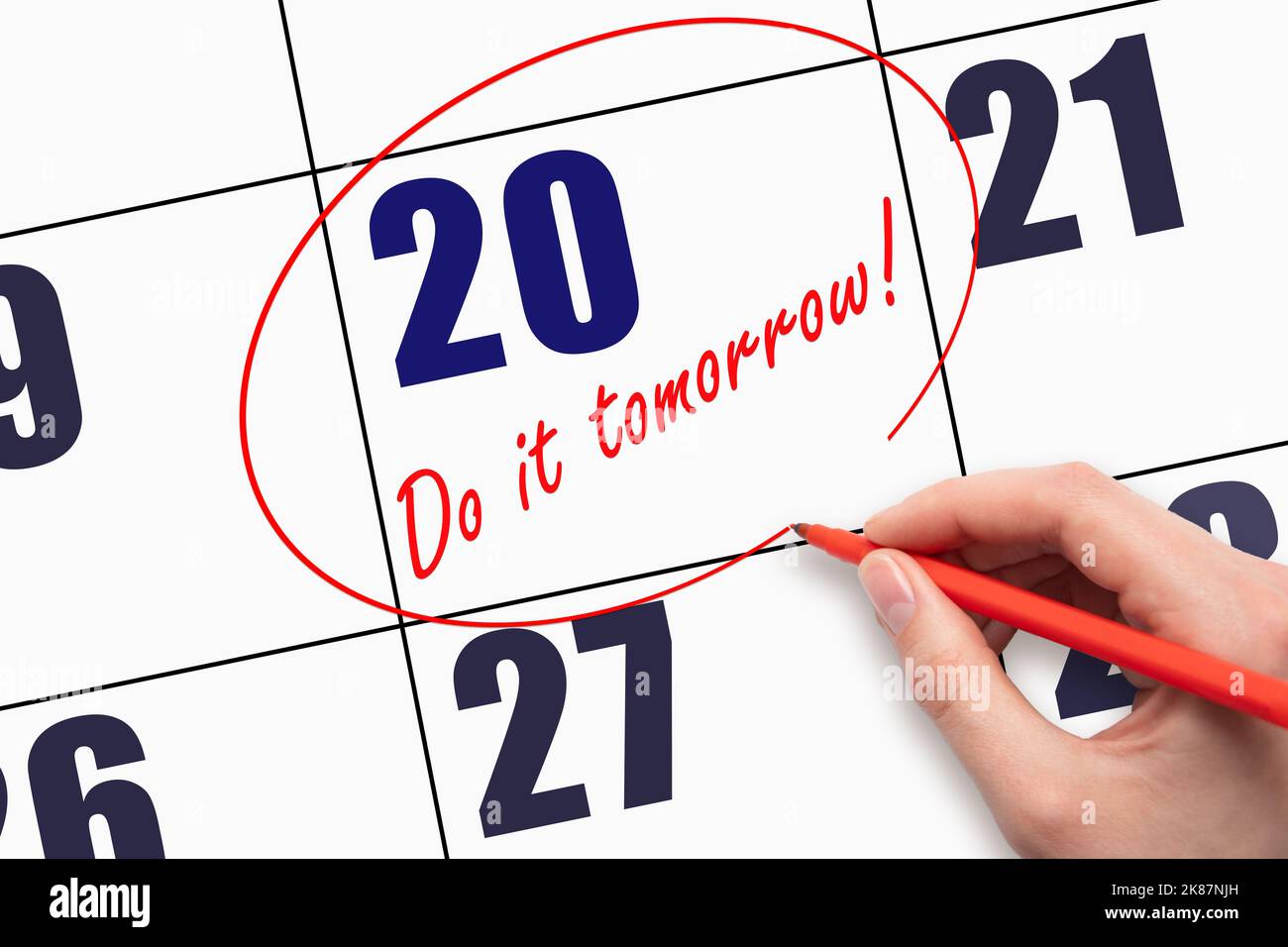 20th day of the month. Hand writing text DO IT TOMORROW and circling ...