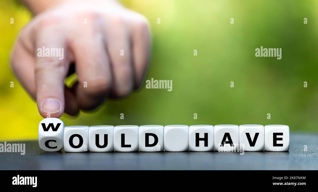 Dice form the expressions 'would have' and 'could have' Stock Photo - Alamy