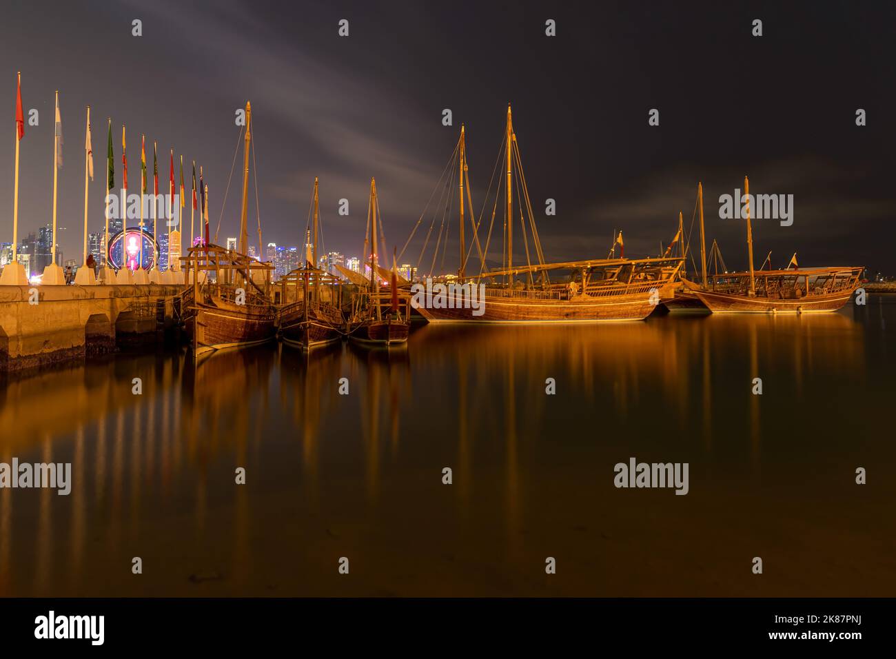 Traditional boats called Dhows are anchored in the Corniche Doha Stock ...