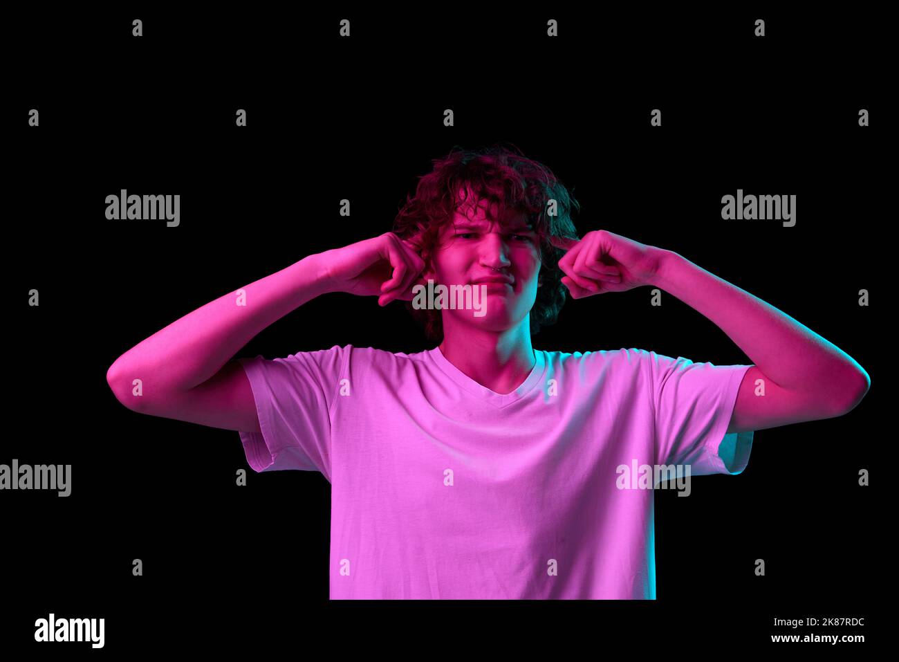 Looks annoyed. Young man with discontent and undercurrent facial ...