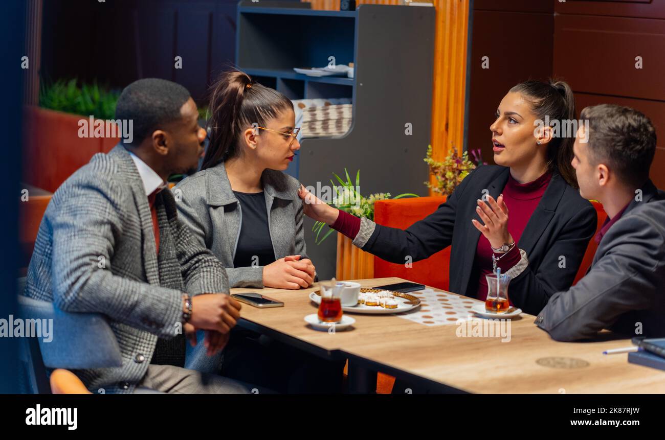 Group of multiracial busniess people are talking Stock Photo - Alamy