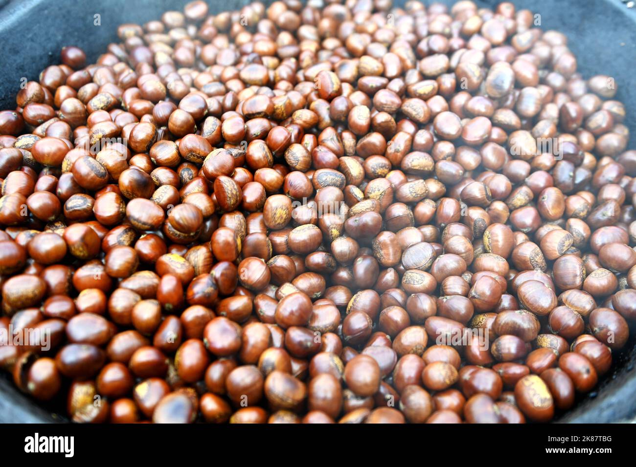 QINGDAO, CHINA - OCTOBER 21, 2022 - Sugar fried chestnuts are seen at a ...