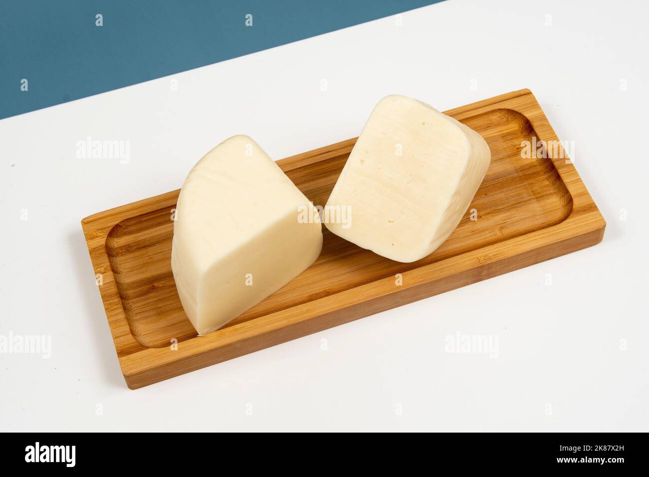 Minas half-cured cheese on a bamboo tray Stock Photo - Alamy