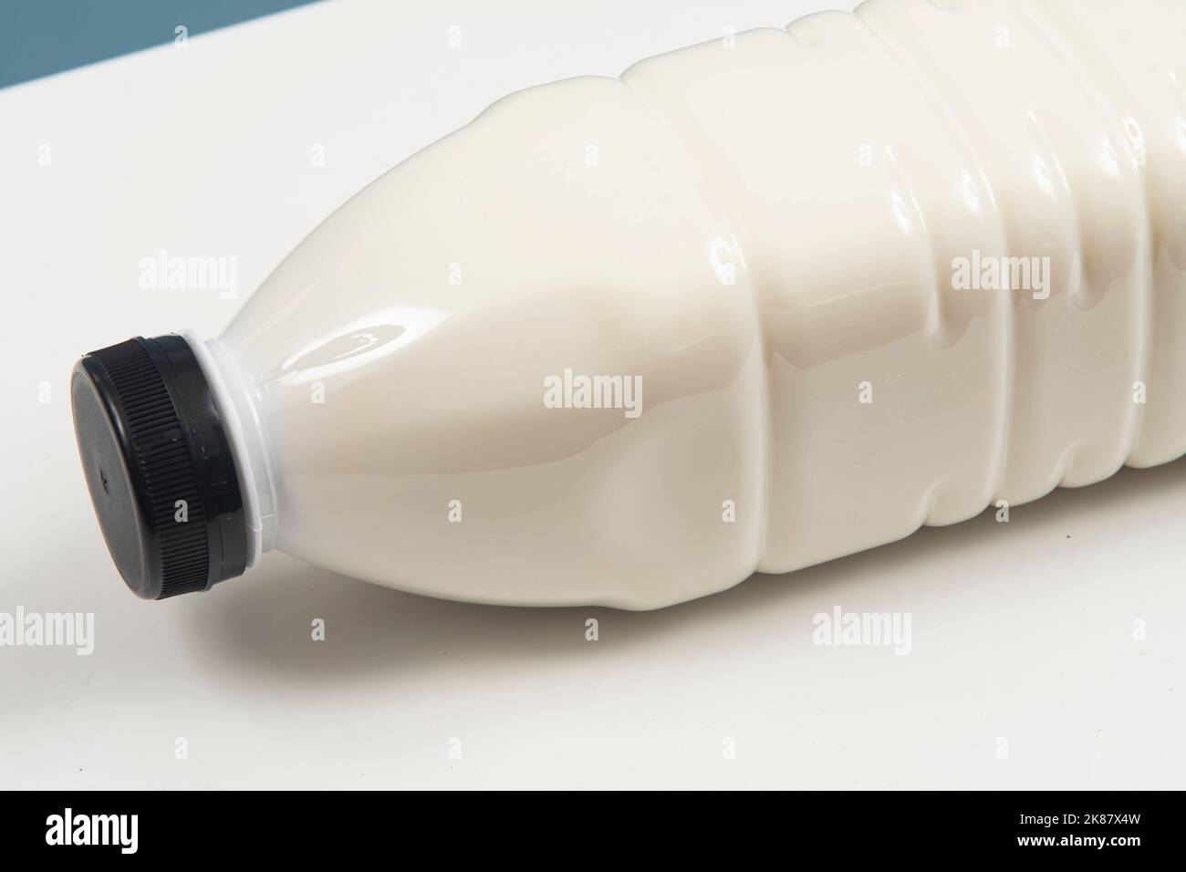 1 liter plastic milk pot on white background Stock Photo - Alamy