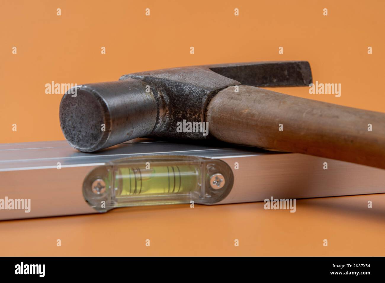 water level and hammer used by mason in civil construction work Stock ...