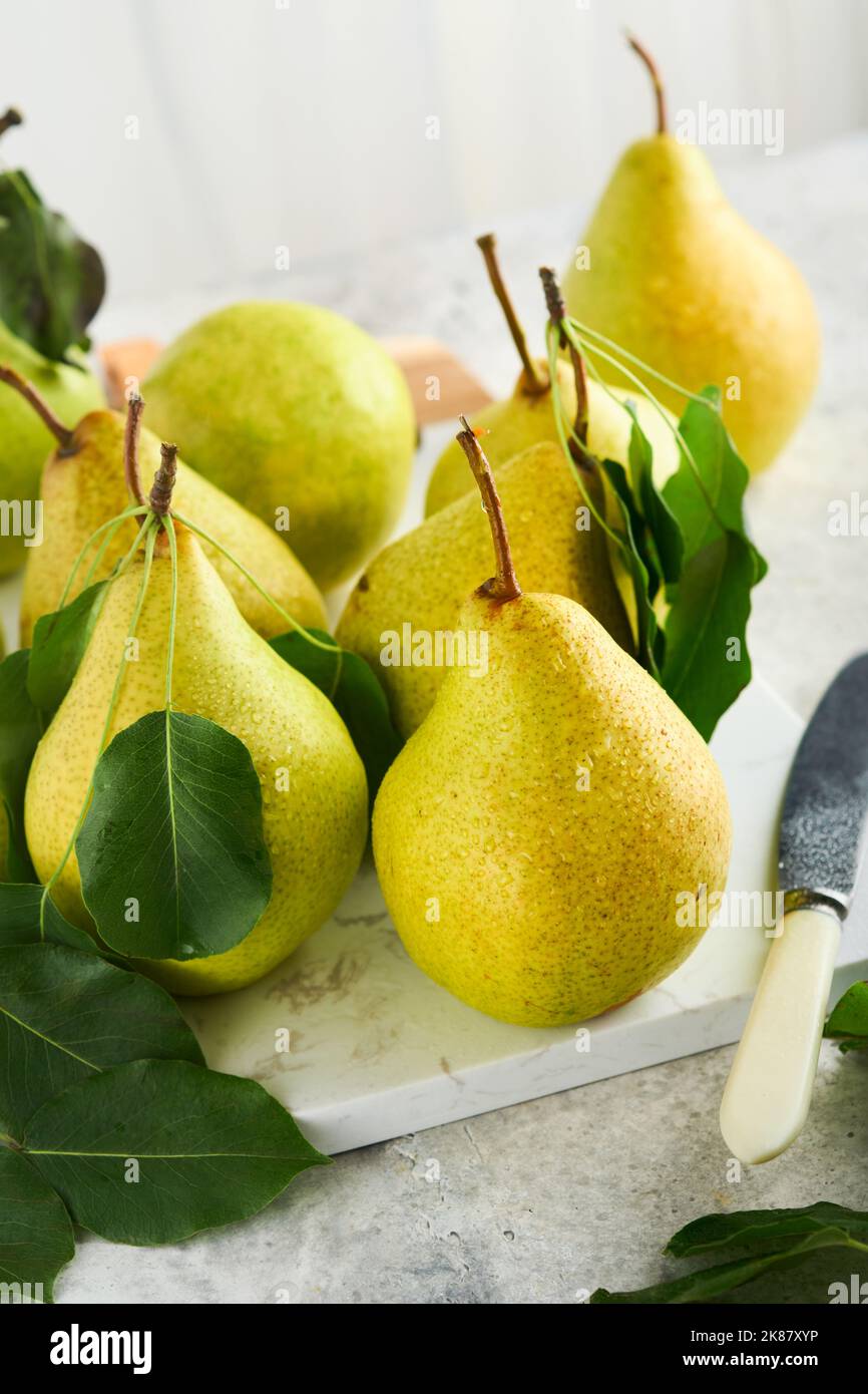 Pears. Fresh sweet organic pears with leaves on stand or plate on old ...