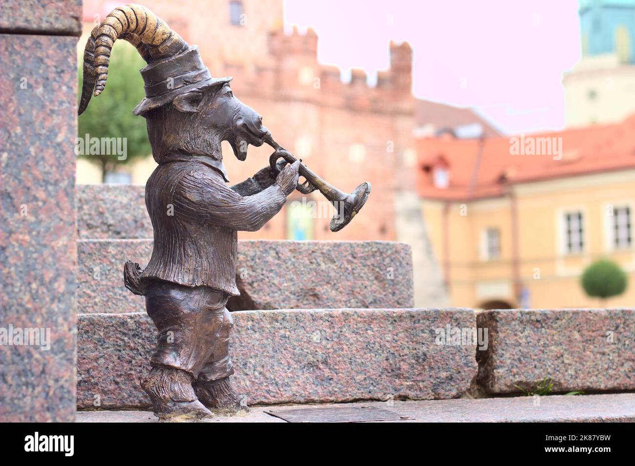 The goat statue holding a trumpet in Lublin, Poland Stock Photo - Alamy