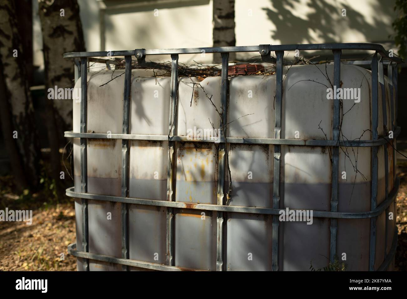 Large liquid capacity. Plastic tank. Large volume. Steel cage Stock ...