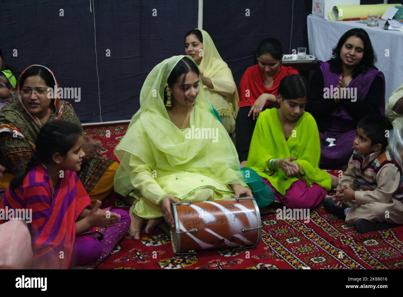 Future Bride playing drums at her hen party, Chakwal, Punjab, Pakistan ...
