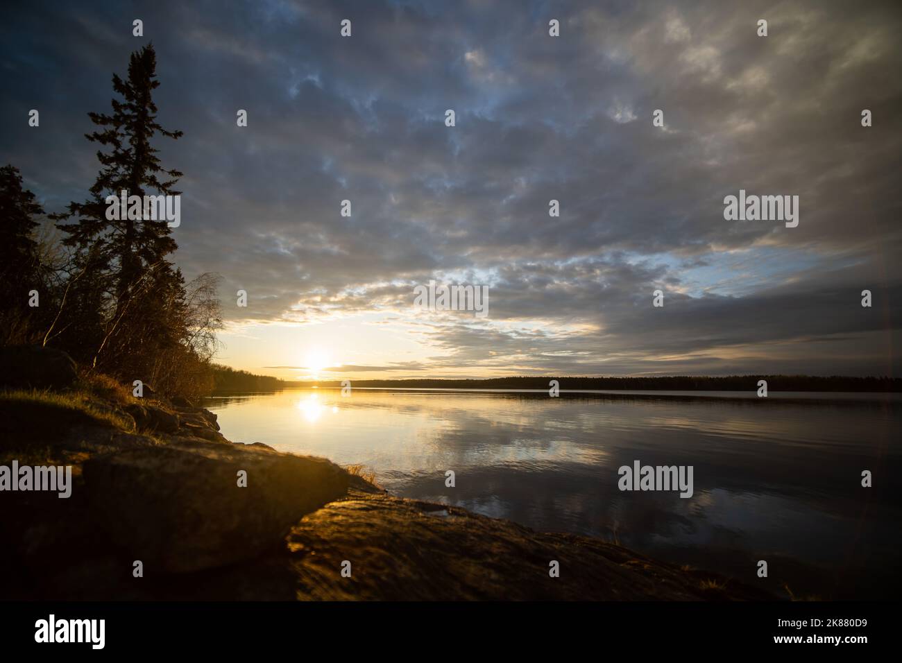 The sunset in the Secluded northern lake near La Ronge, Saskatchewan ...