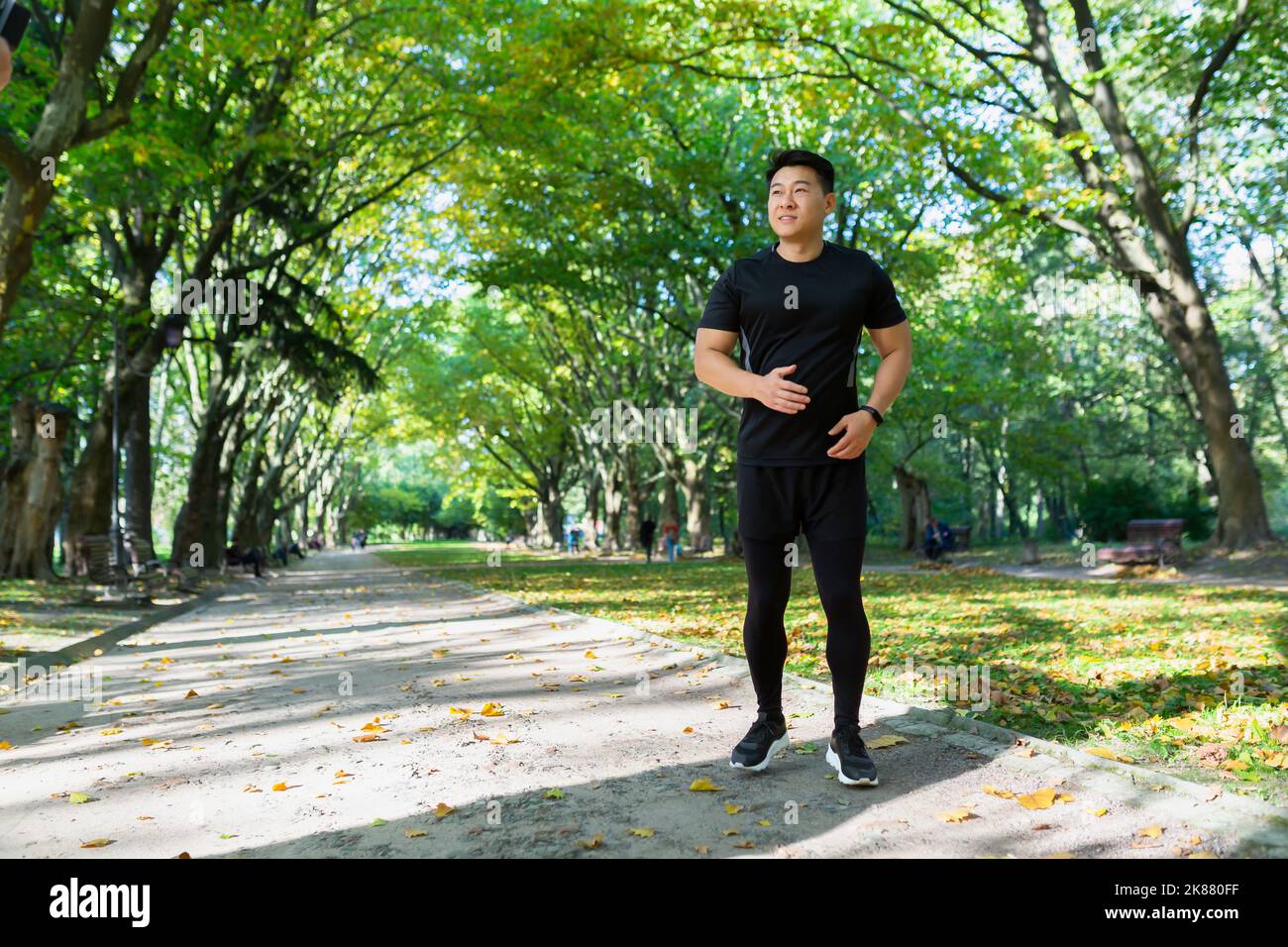 Full length portrait, asian man running in office park, man in ...