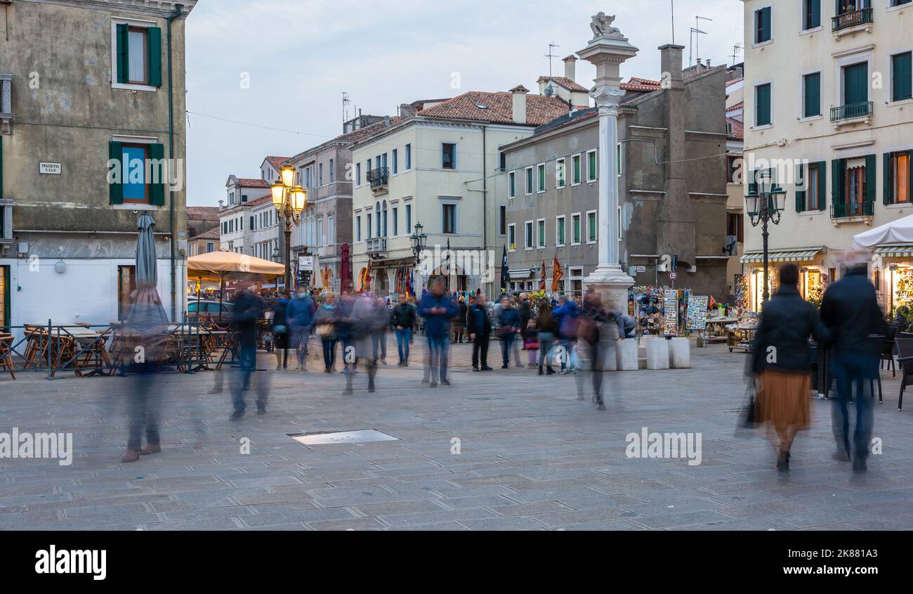 tourists and colorful multicolored buildings on main street Corso del ...