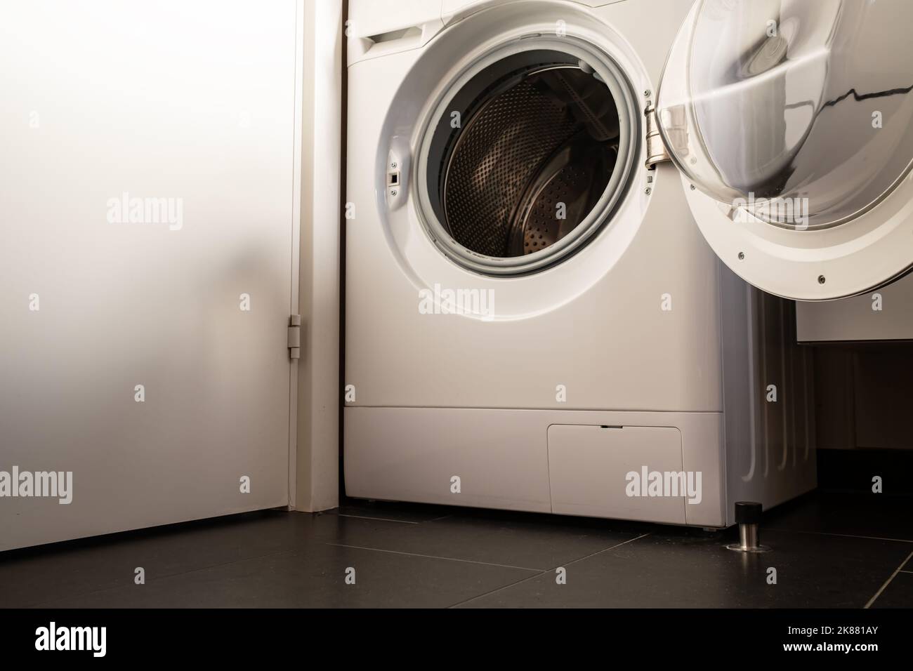 Empty open washing machine. Drying and airing the washer machine after ...