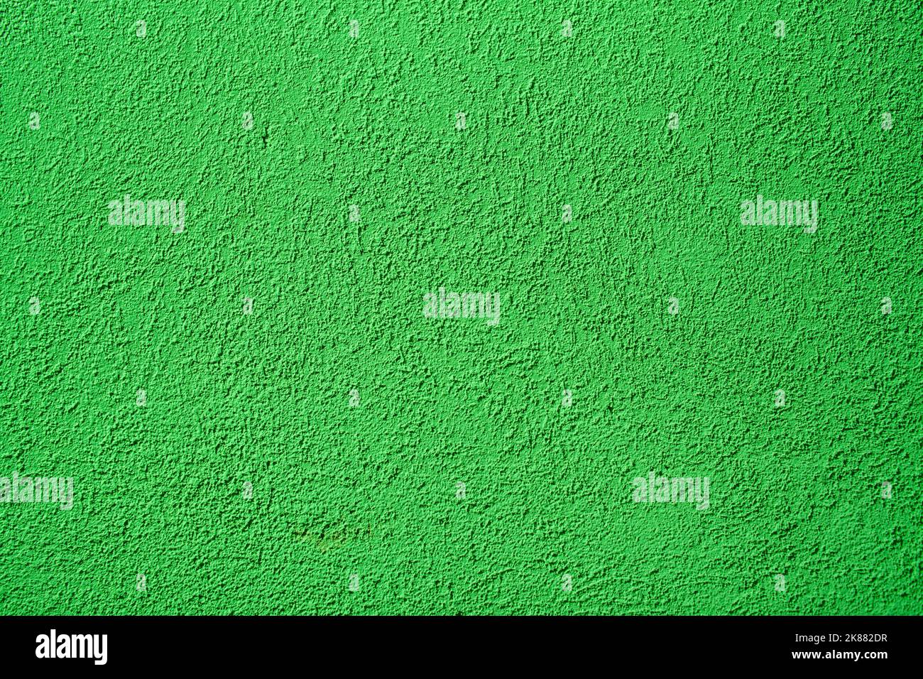 Background of green concrete wall. Decorative embossed concrete and ...