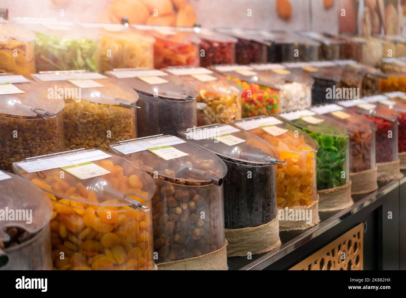 Assorted dried fruits in plastic containers in the store close-up Stock ...