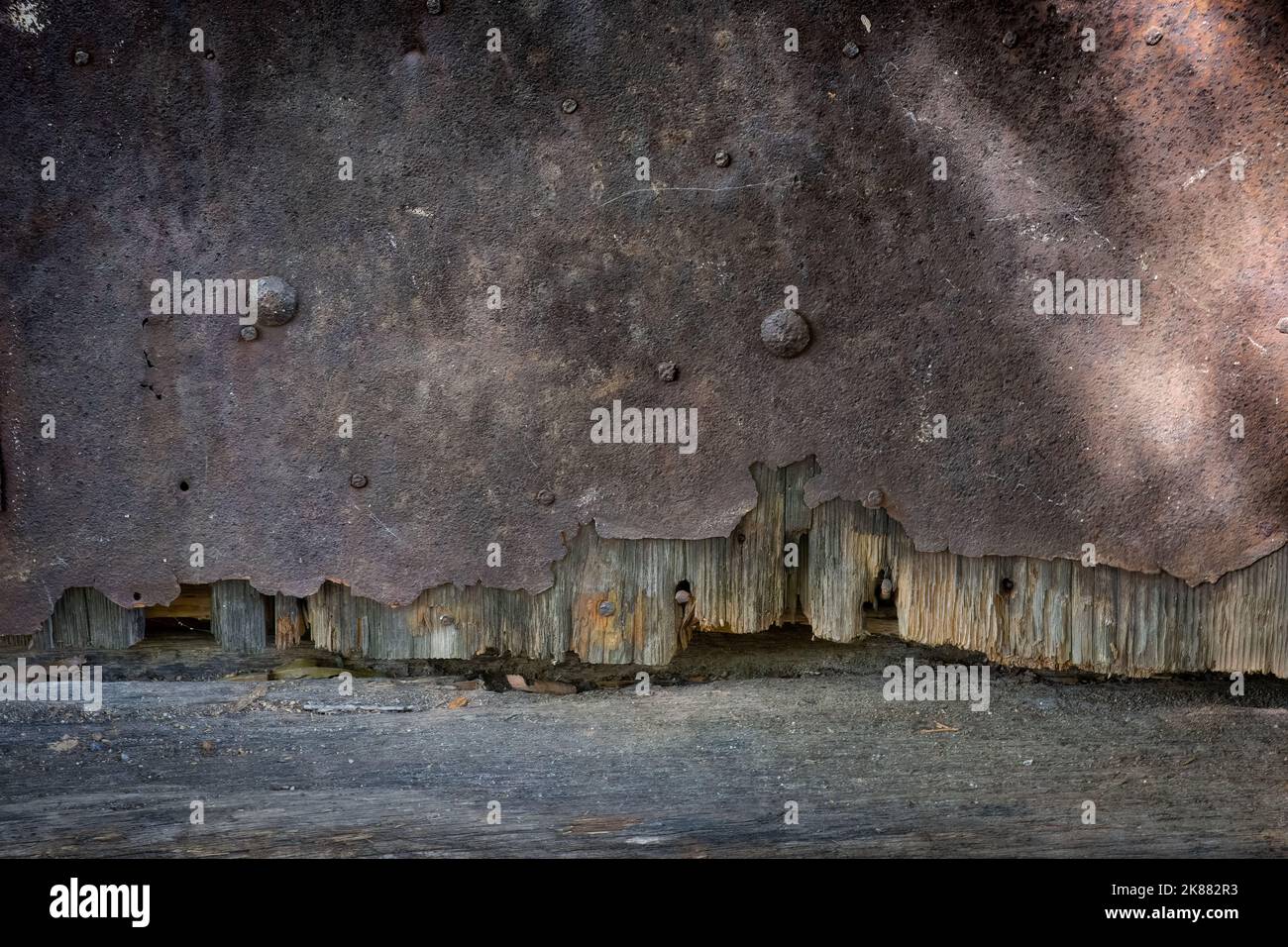 Corroded metal plate and bolts over very old wooden boards Stock Photo ...