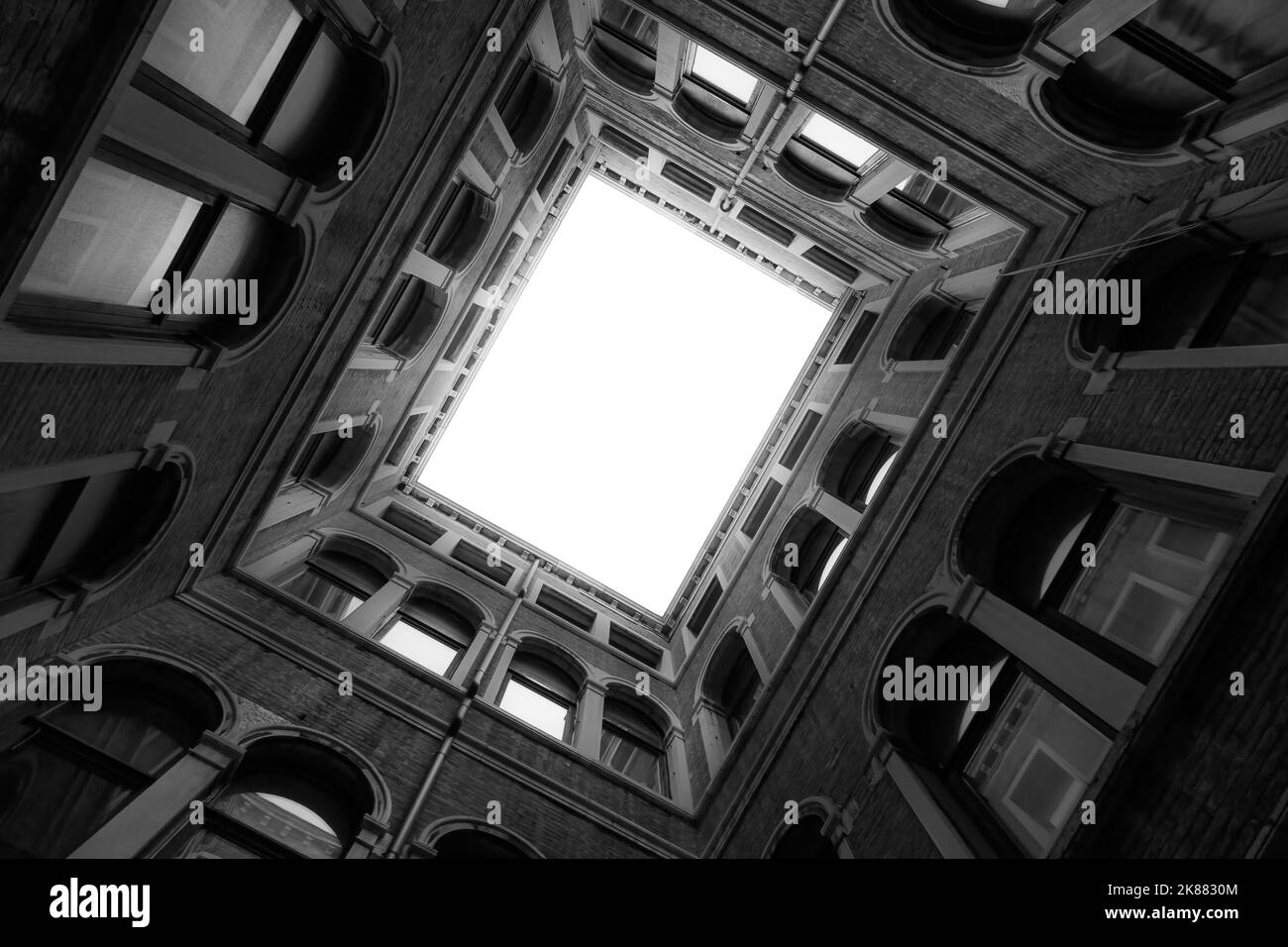 A minimalistic low angle of a square building in a grayscale Stock ...