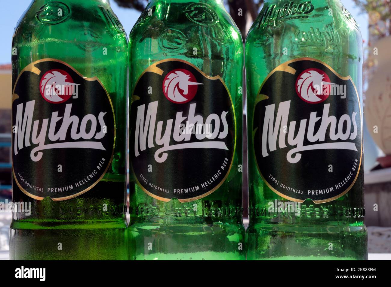 Three (3) Green glass Mythos bottle. Hellenic beer Stock Photo - Alamy