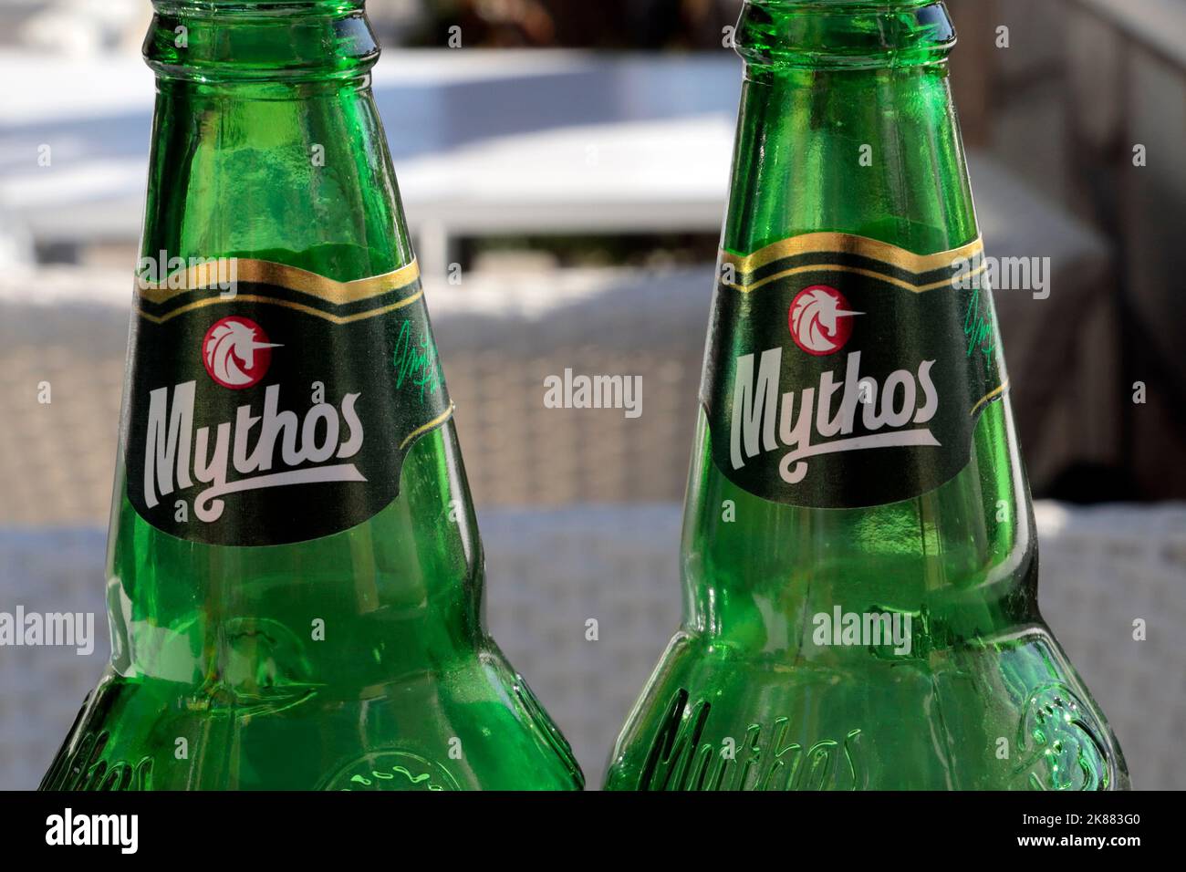 Two Green Mythos Greek beer bottles outdoors on a sunny day. Sept / Oct ...