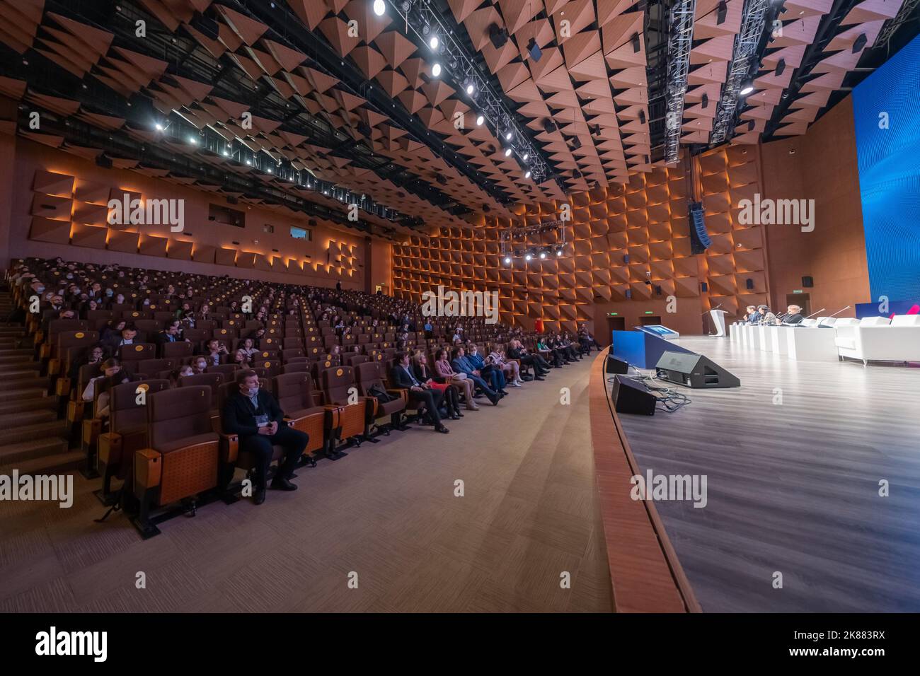 People sitting near stage during business conference Stock Photo - Alamy