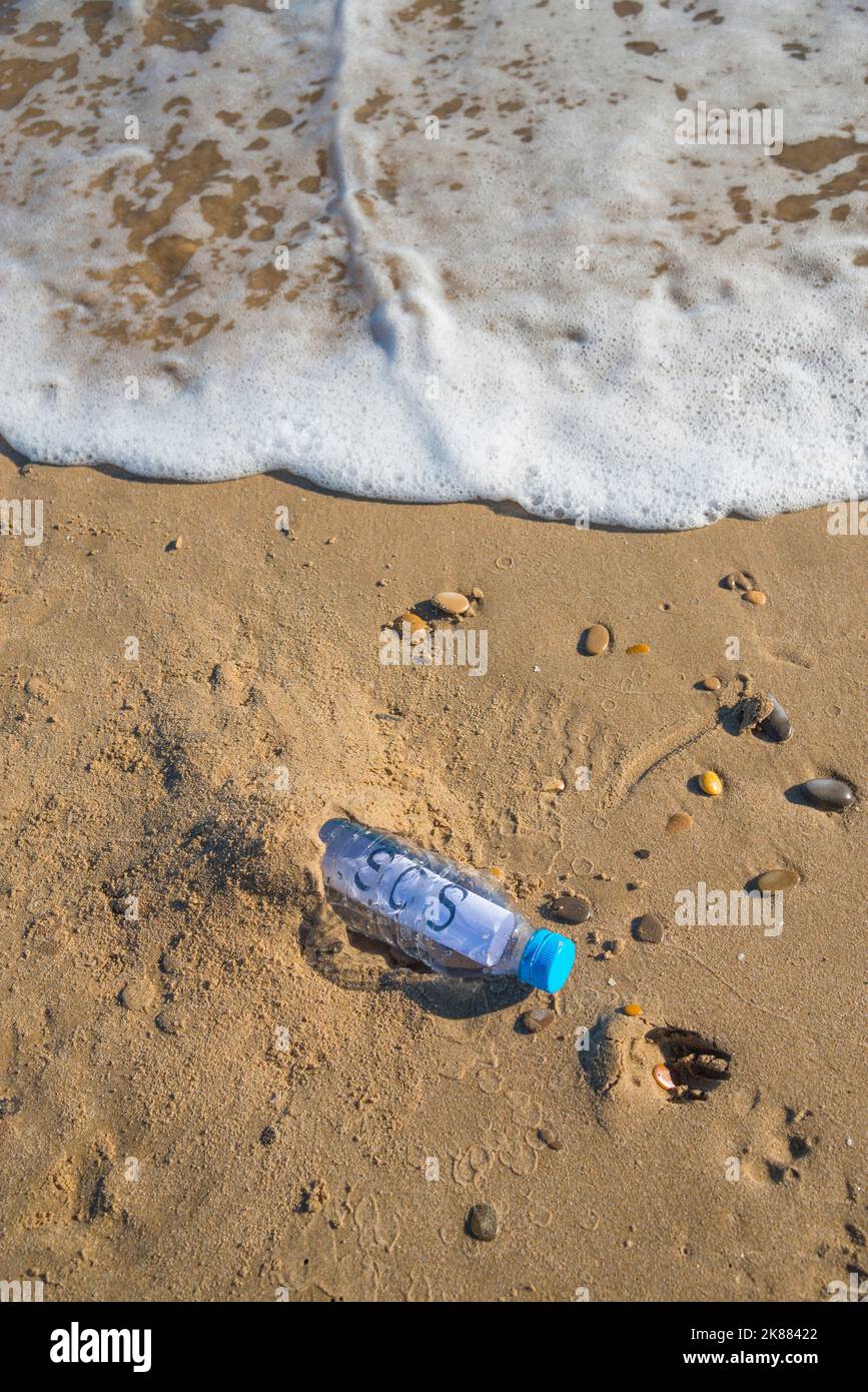 Sea plastic contamination. SOS message in a plastic bottle on the sea ...