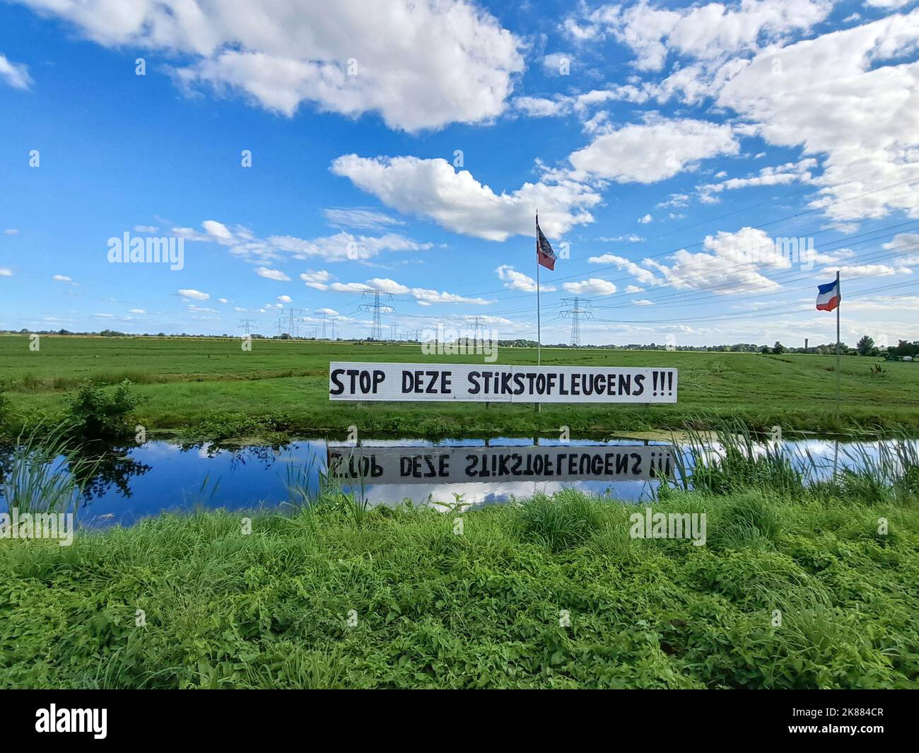 Protest signs and rows of flags upside down in Lekkerkerk along the ...