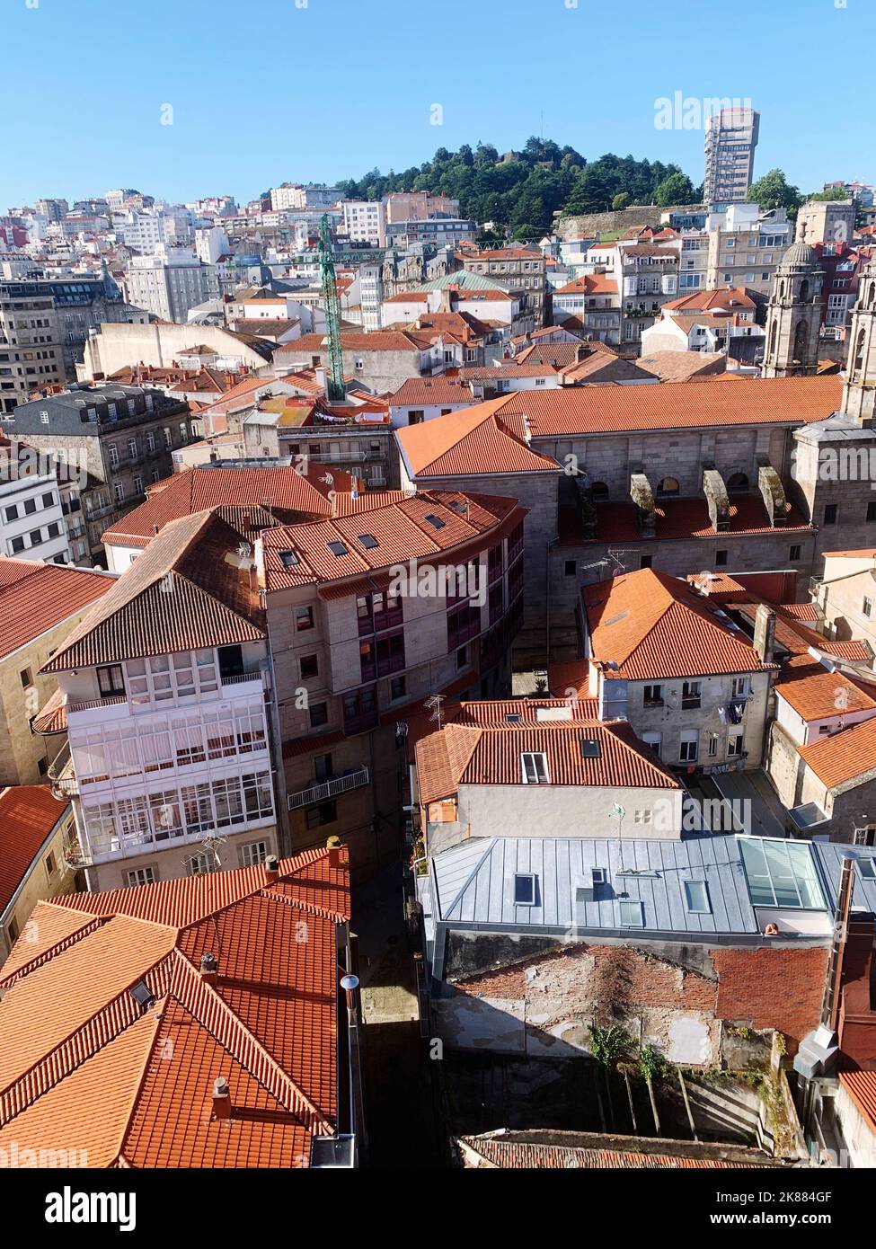 A vertical shot of buildings in the city of Portugal under a clear blue ...