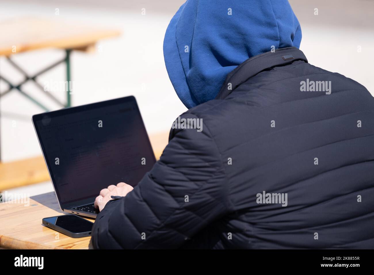 Anonymous male freelancer using laptop Stock Photo - Alamy