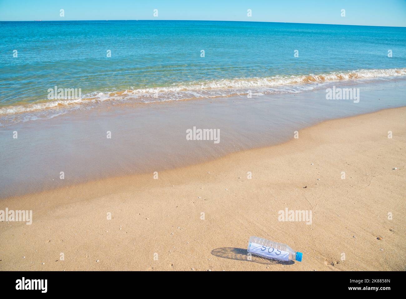 Sea plastic contamination. SOS message in a plastic bottle on the sea ...