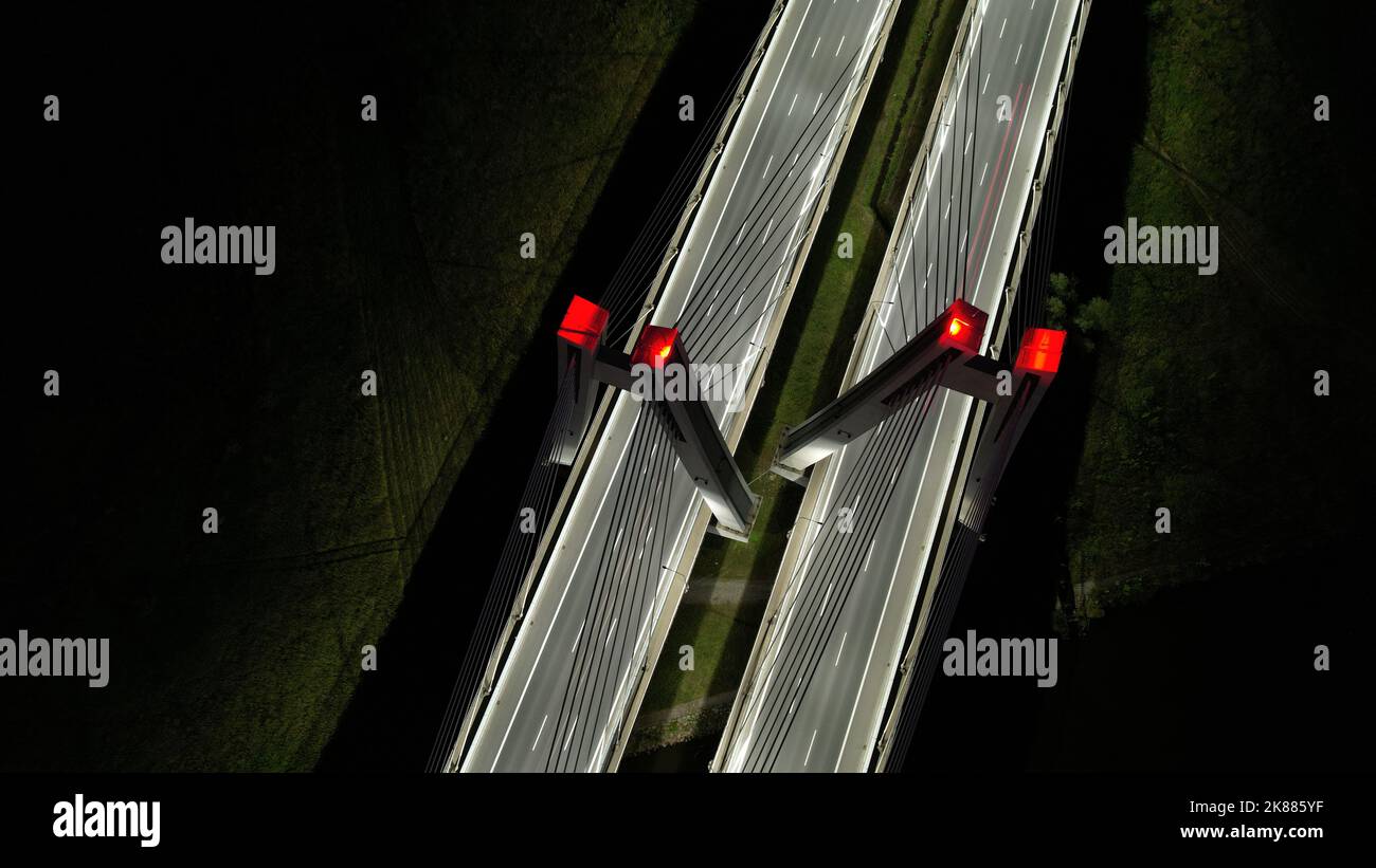 An aerial of a highway bridge in lights during the night Stock Photo ...