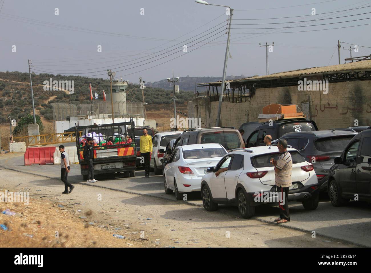 Nablus, Palestine. 21st Oct, 2022. Palestinians wait to enter the city ...