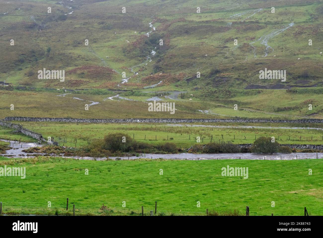 A view of a mountain stream after heavy rain that's flooded farmers ...