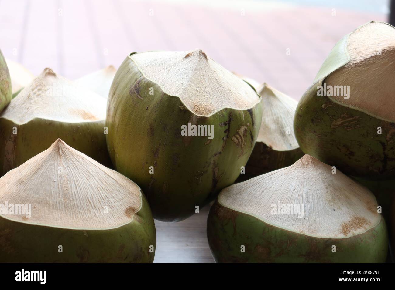 stack of fresh coconut display for sale Stock Photo - Alamy