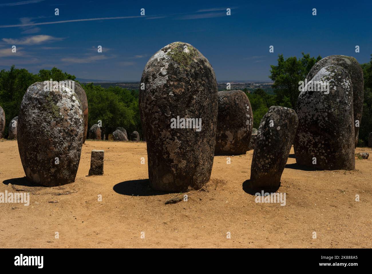 Massive granite boulders shaped like eggs or almonds were grouped in ...