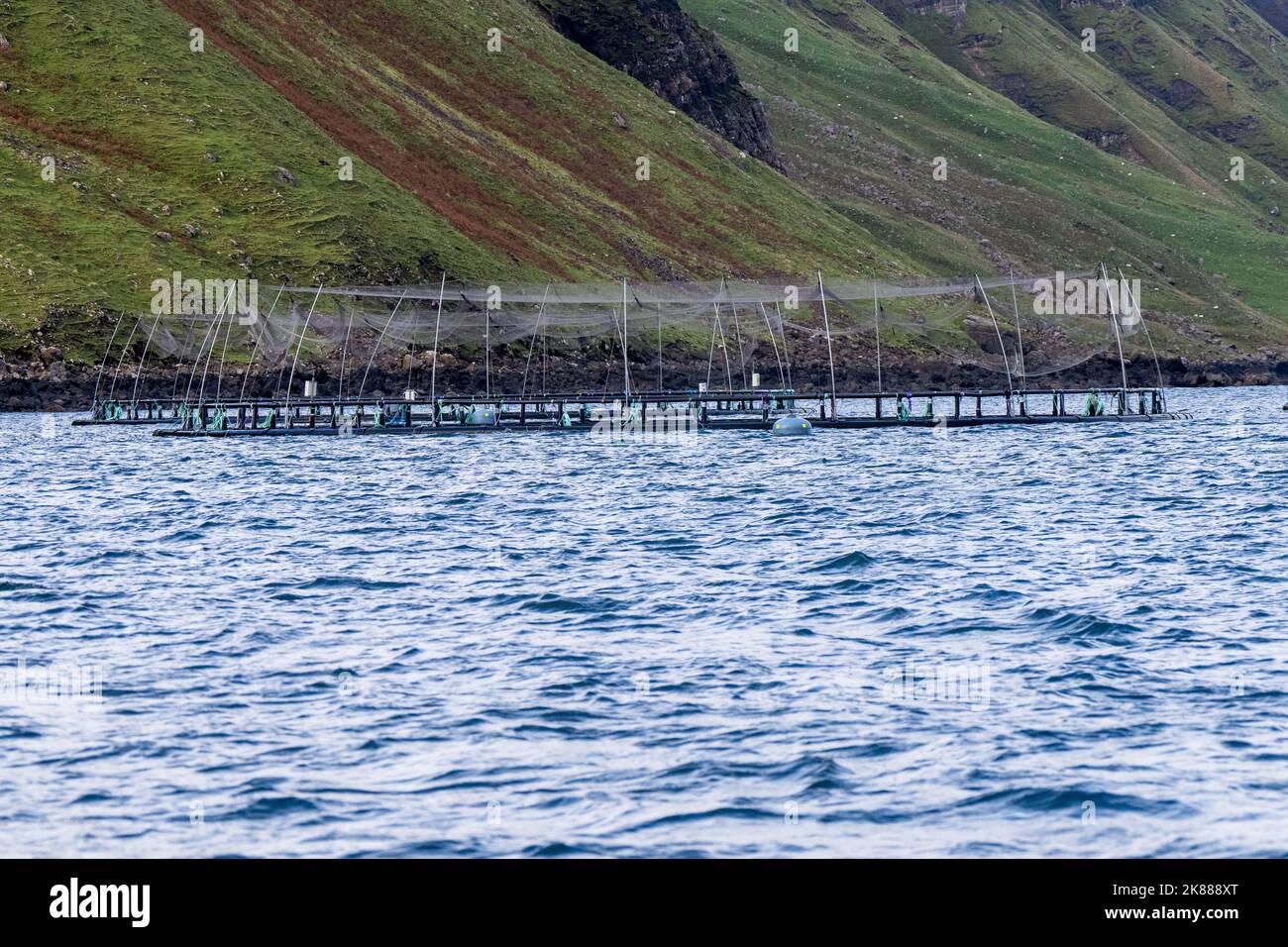 A new Salmon fish farm with nets at Portree Harbour Isle of Skye ...