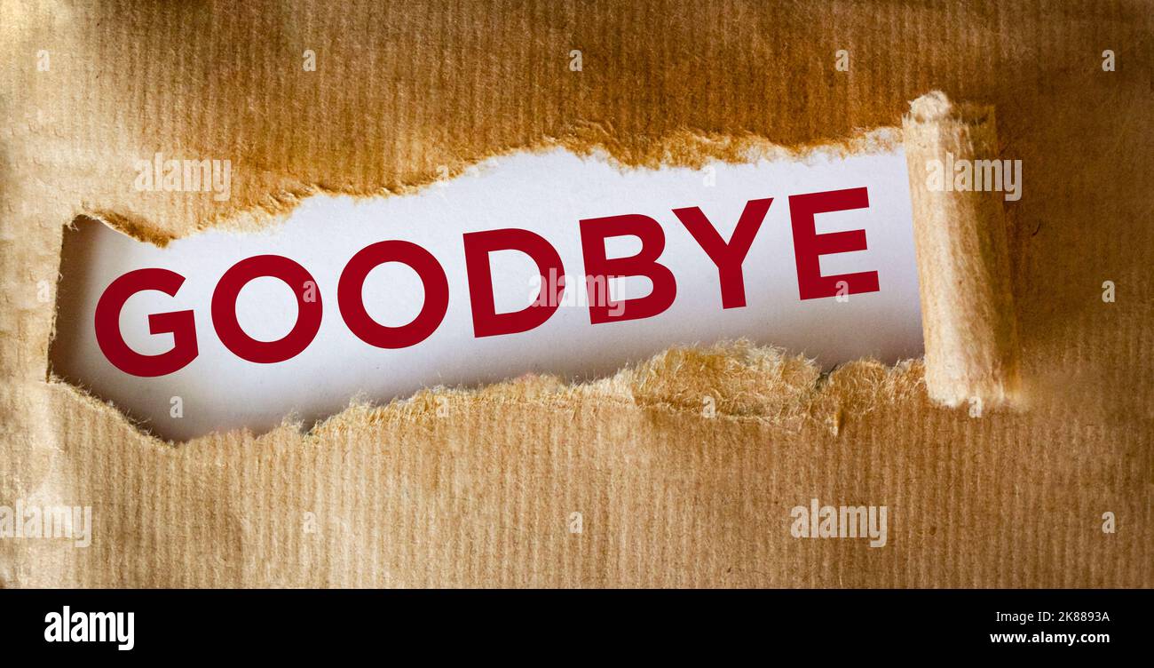 Goodbye text appearing behind torn brown paper Stock Photo - Alamy