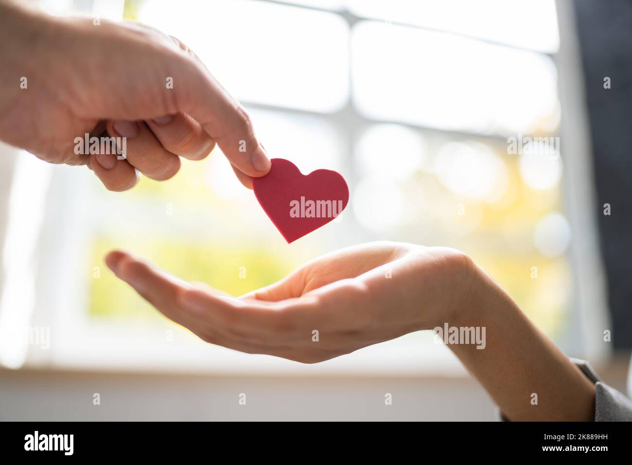 Women holding heart african american hi-res stock photography and ...